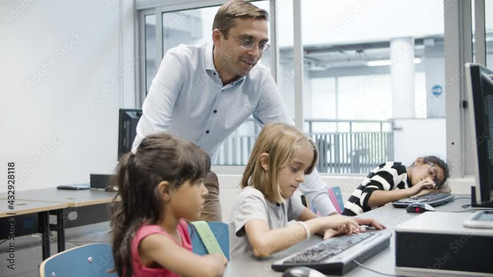 Multiethnic girls doing task on computer science together. Blonde kid ...
