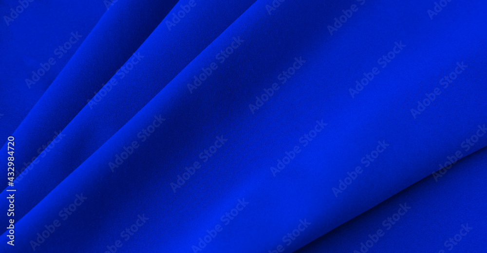Smooth elegant blue silk or satin luxury cloth texture can be used as ...