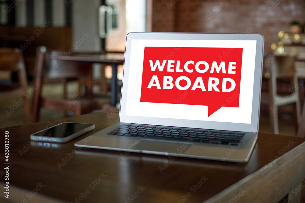 WELCOME ABOARD Business team hands at work with financial WELCOME ...