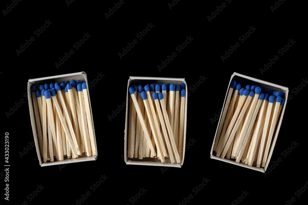Fire matches pile, matchsticks with blue tips in cardboard boxes ...
