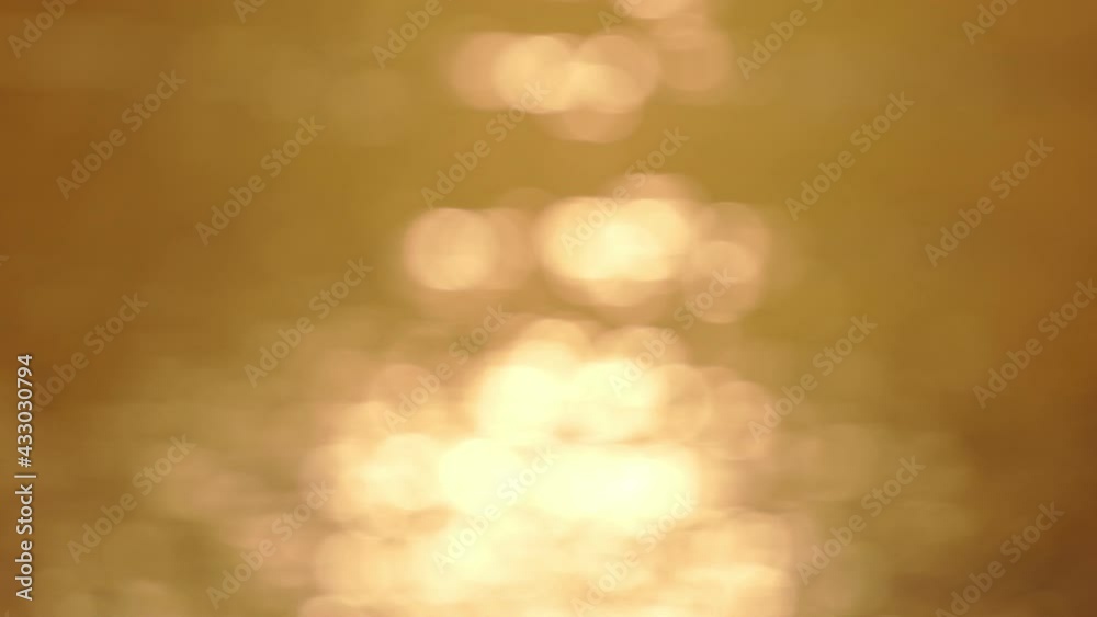Bokeh sun glare reflection of Sunset sunrise light in water surface ...