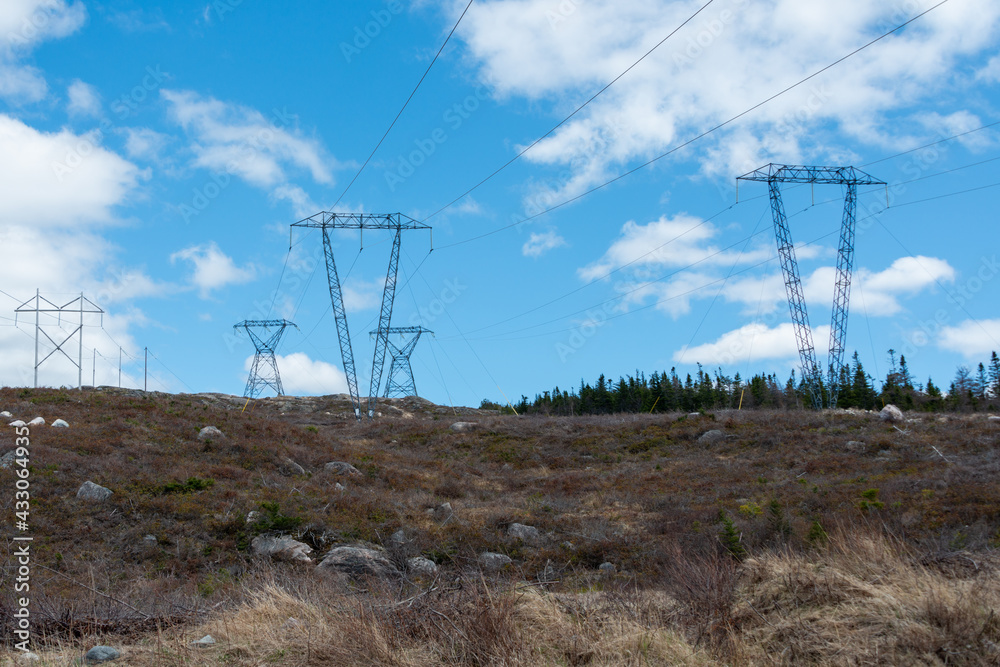 Large transmission lines and metal towers moving electricity ...