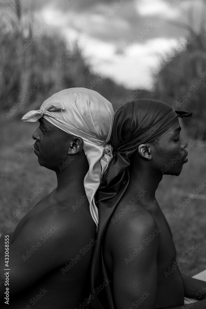 Young men in do-rags in cane field Stock Photo | Adobe Stock