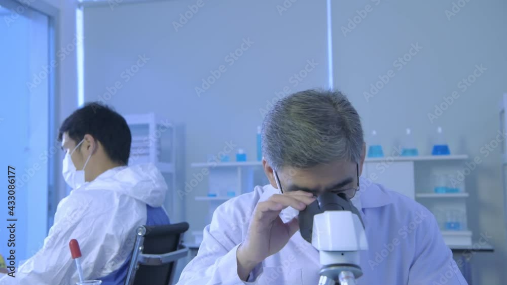 Research concept of 4k resolution. Asian scientists are examining the ...