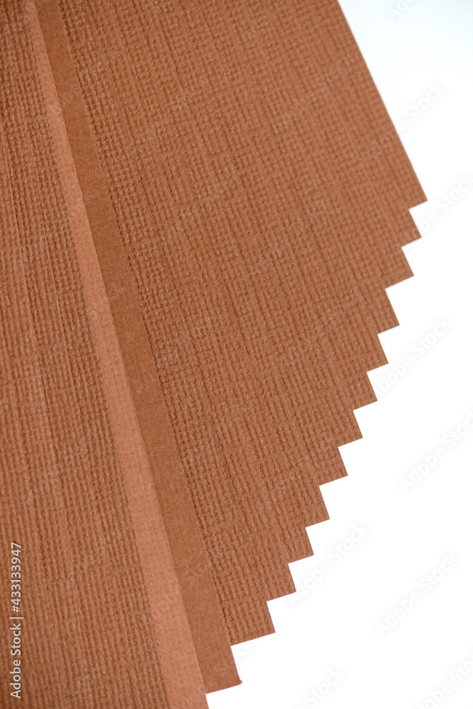 hazel brown cut craft paper piled in a stepped pyramidal manner ...