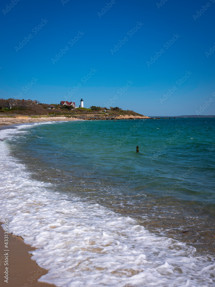 Blue ocean landscape with long white foamy waves washing up on the ...