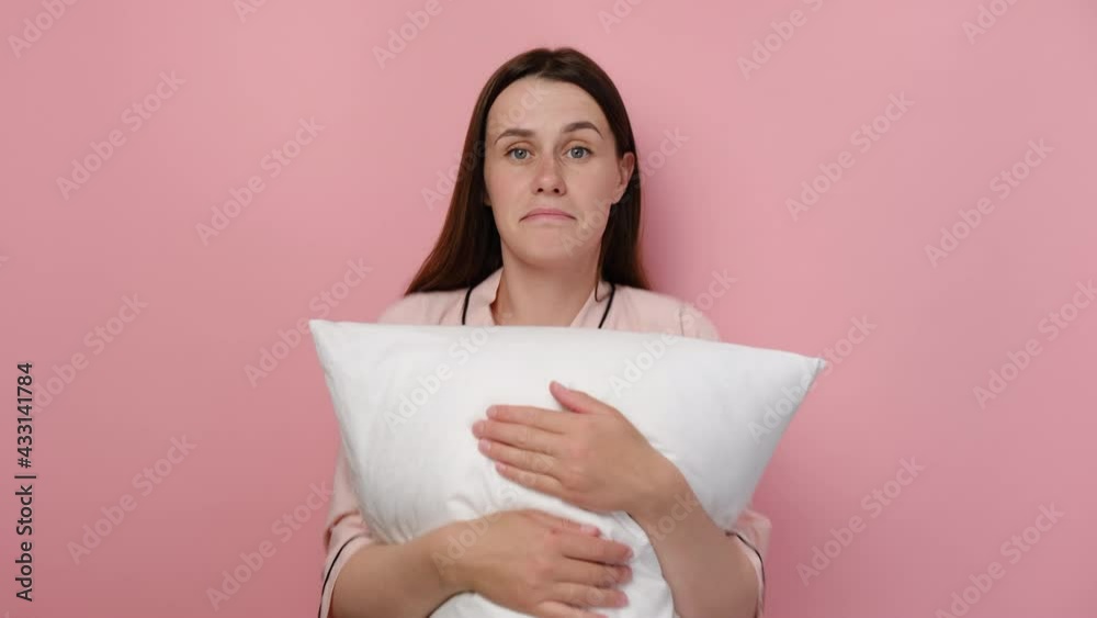 Pensive young woman 20s in pajamas making unimportant and doubts ...