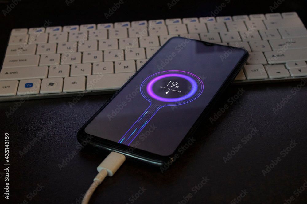 BELARUS, NOVOPOLOTSK - 11 MAY, 2021: The phone xiaomi is charging Stock ...