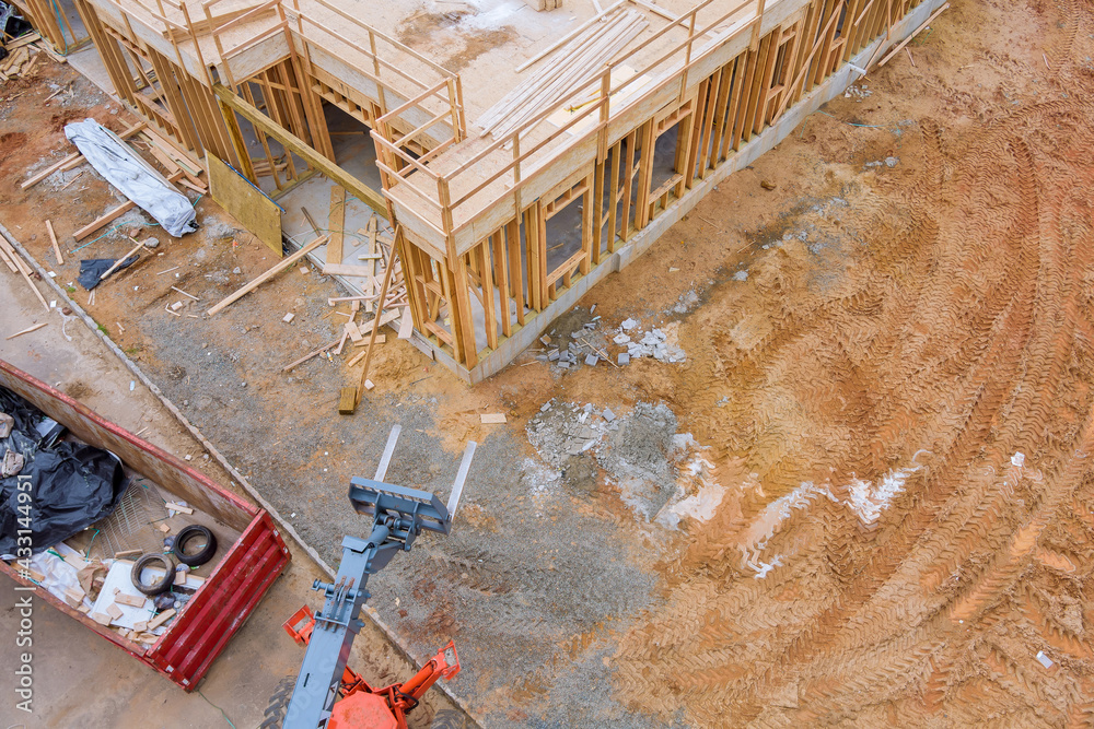 Aerial view of big construction dumpster on stacker wooden material ...