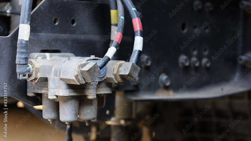 Truck air brake valves and air ducts.Four-circuit protection valve or ...