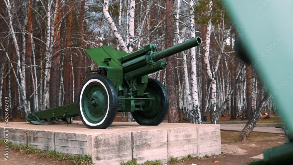 Old Soviet World War 2 artillery gun standing in a memorial park ...