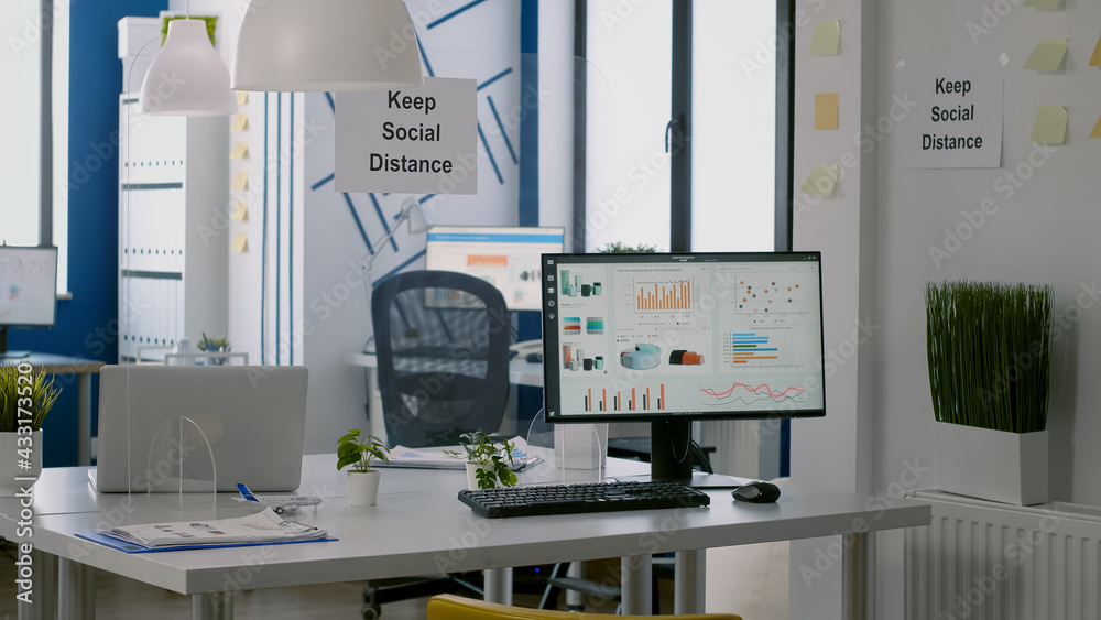 Computer with financial data in modern office interior with keep social ...