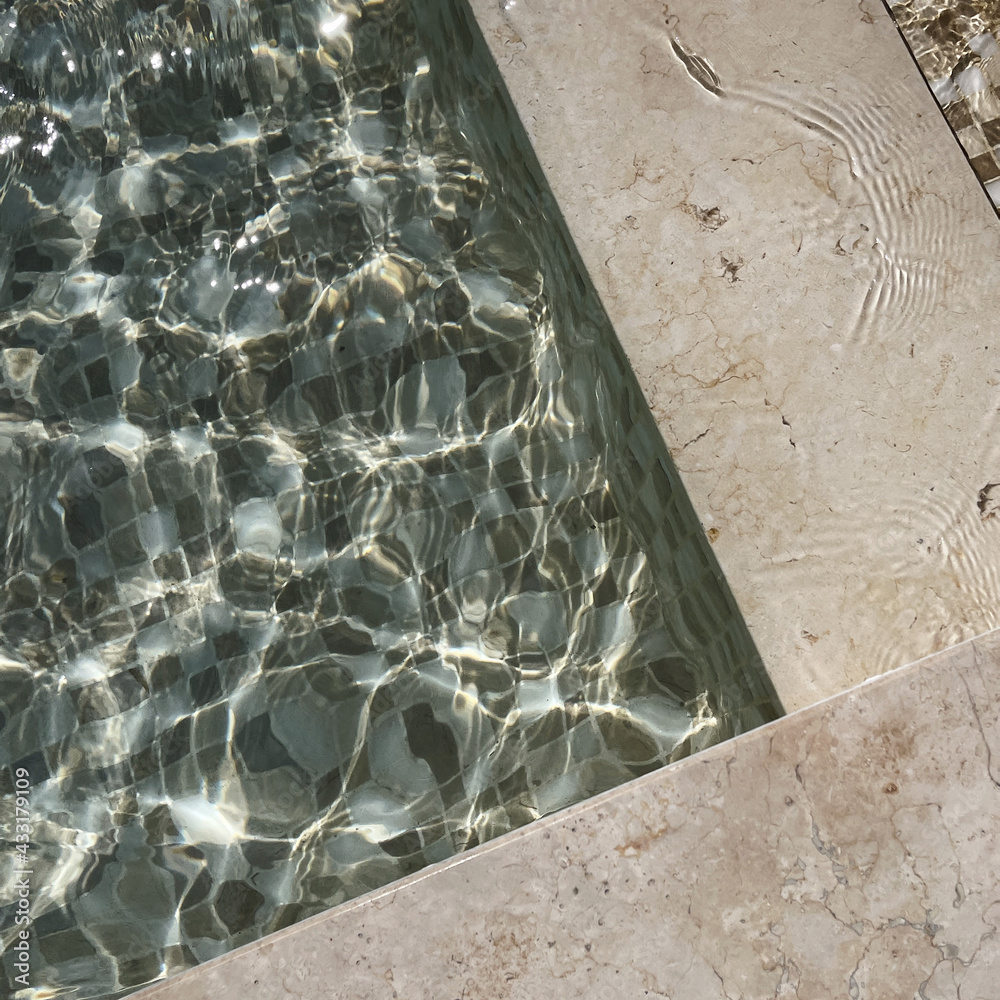 Beautiful view of swimming pool side with clear blue water with ...