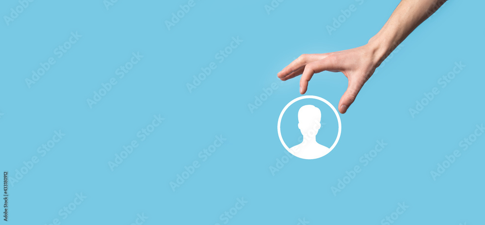 Hand holds user person icon interface on blue background.User symbol ...