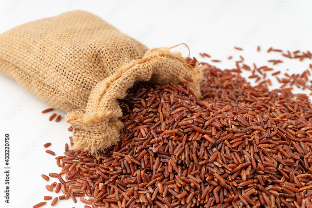 Red rice (brown rice) in a sack isolated on a white background, Red ...