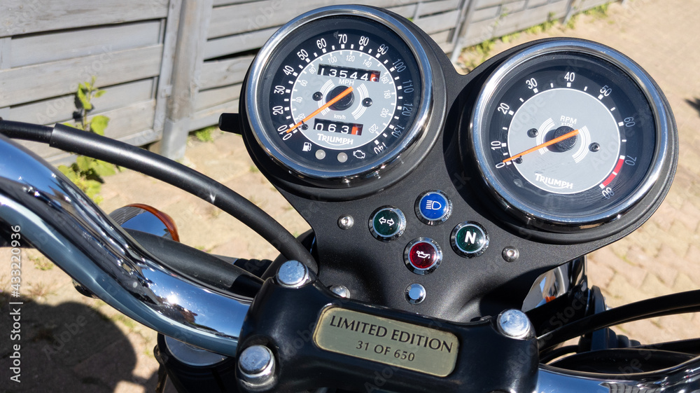 Triumph logo sign on speedometer dashboard bonneville t100 motorcycle ...