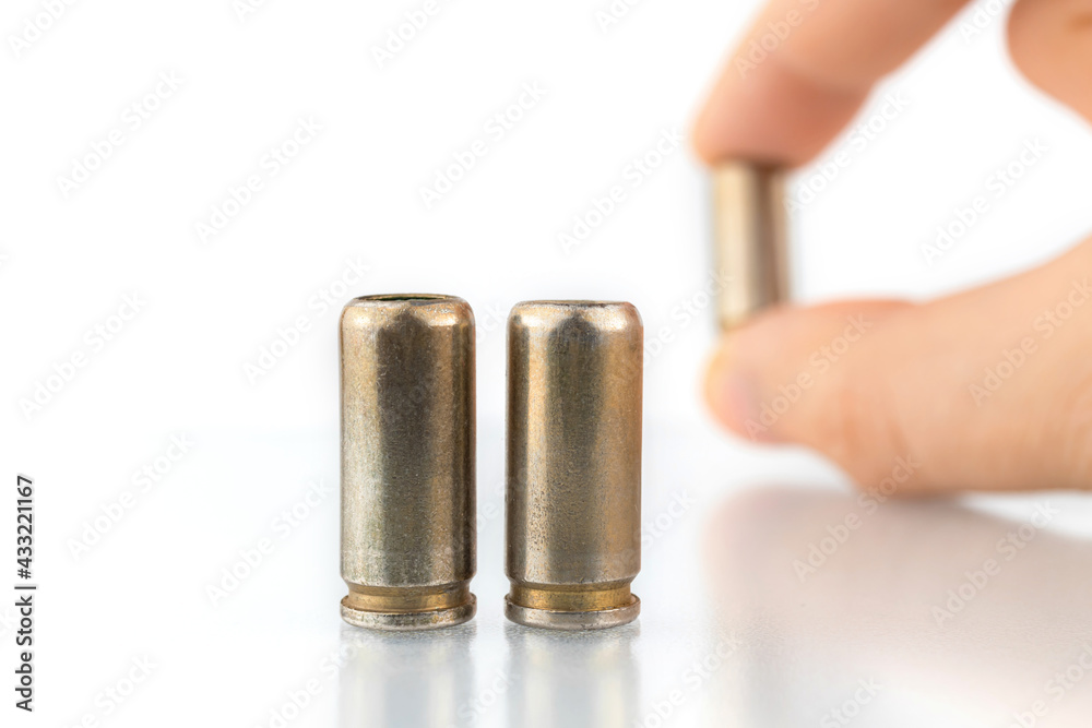 9mm bullets isolated on white background, hand with bullet shell Stock ...