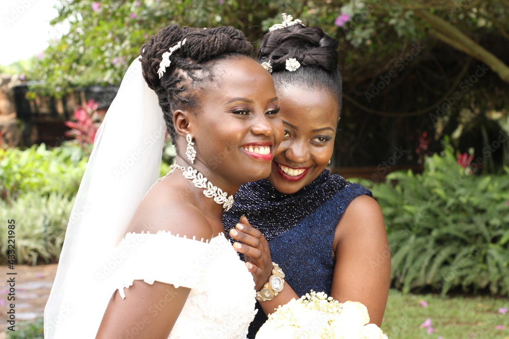 The bride one of her bride maids pose different ways, smiles and facial ...