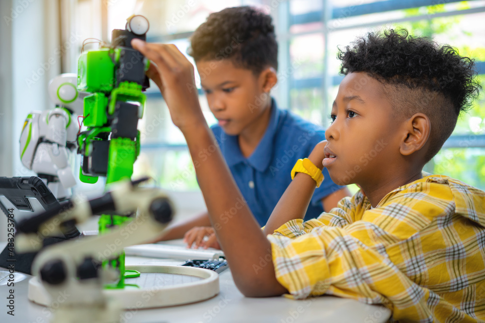 African american boy are setting robot kit in classroom. Stock Photo ...
