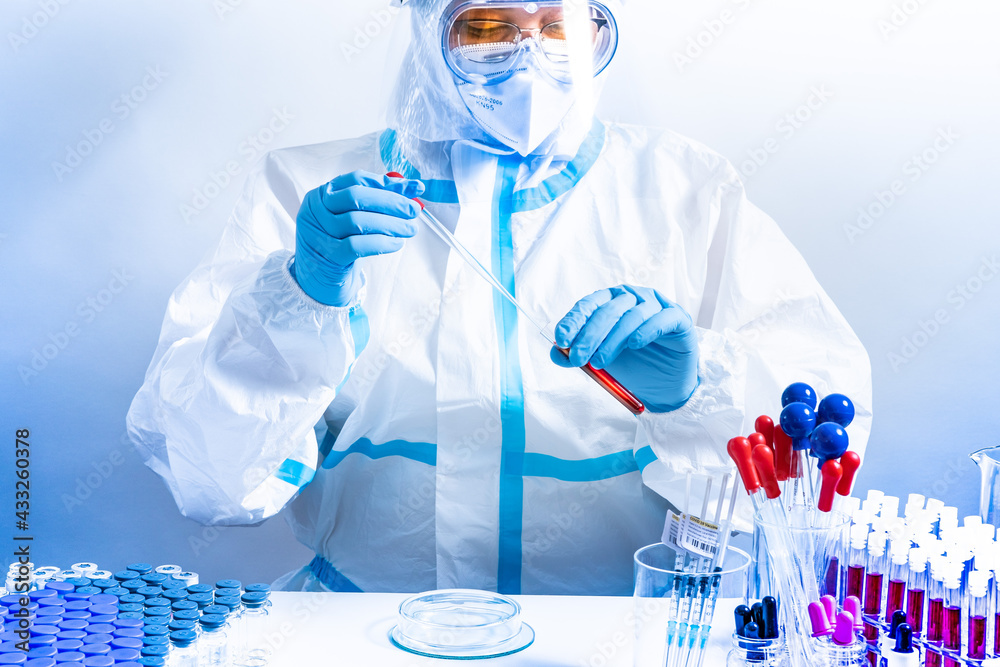 Medical laboratory with equipment and Microbiology scientist wearing ...