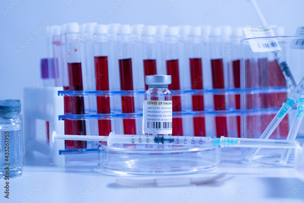 Glass bottle vial and syringe with Covid-19 Coronavirus vaccine in a ...