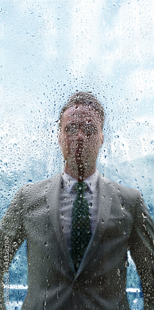 Business man face standing in front of a window with rain drops. Stock ...