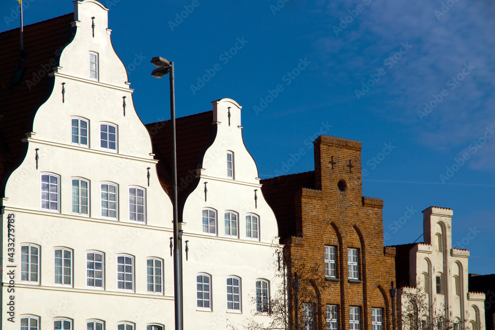 The typical stepped gable in the center of Luebeck on the Trave River ...