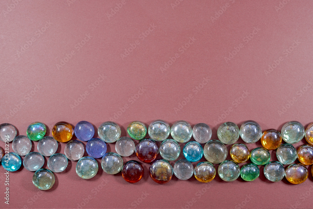 Blue green red yellow glass beads as a frame for your own background ...