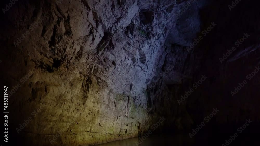 Giant limestone underground cave Pond river water flow reflecting the ...