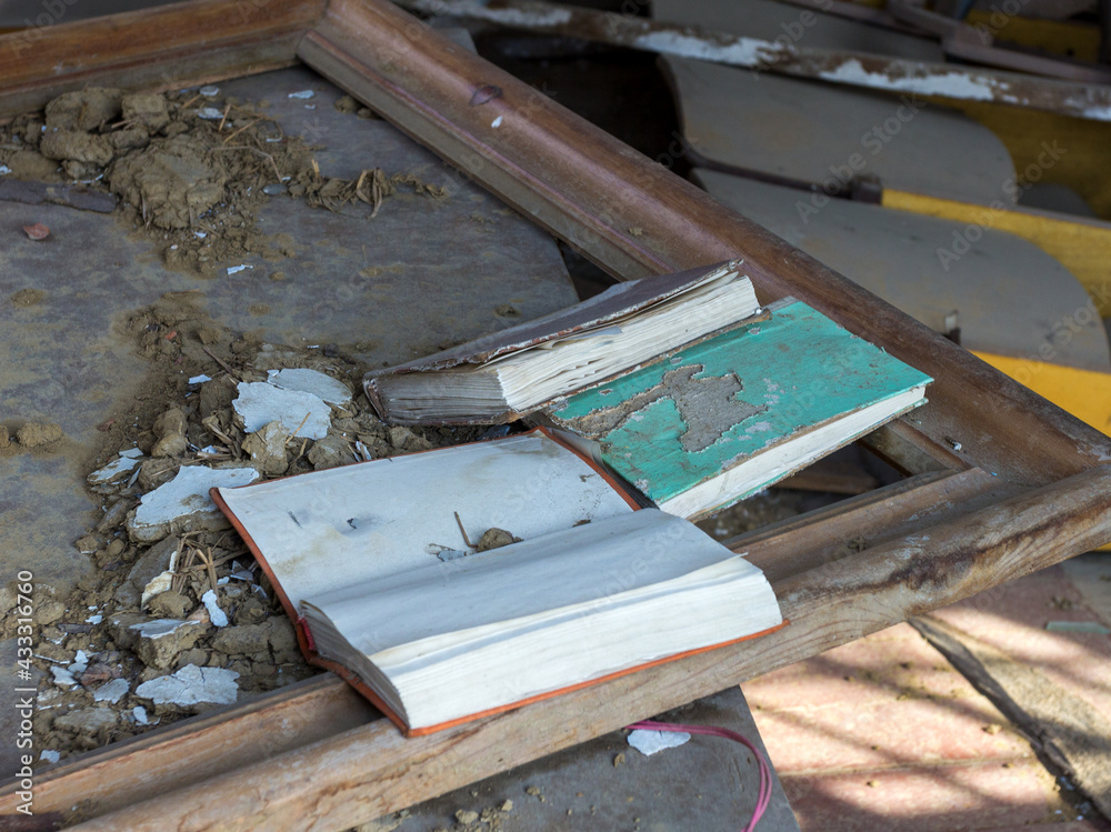 An old ruined and abandoned building of a rural library in a mountain ...
