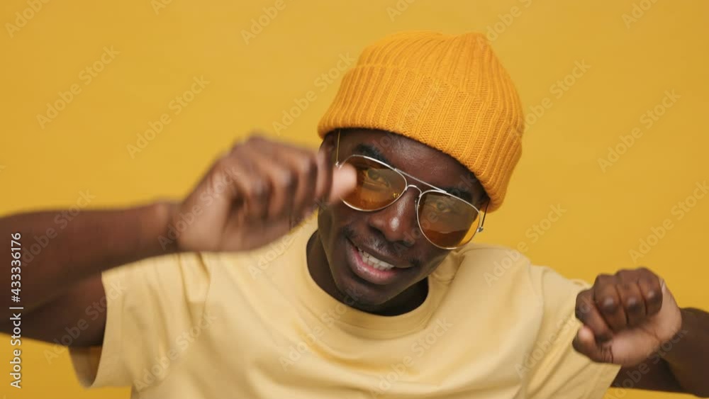 Dancing happy funny black African American man moving to music waving ...