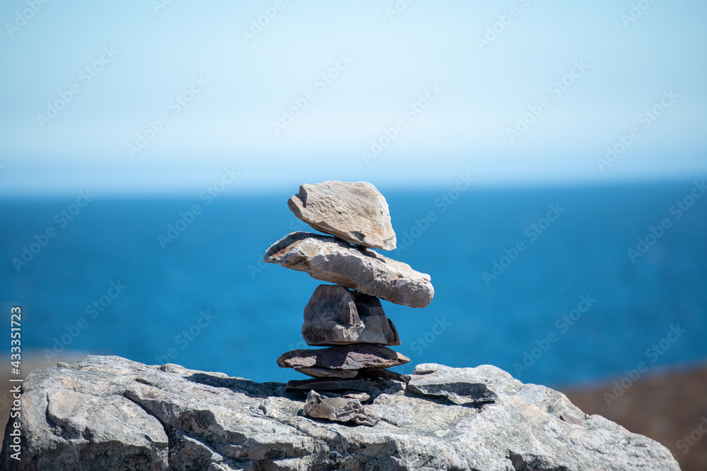 Inukshuk, a stack of granite rocks in the form of a person. The ...