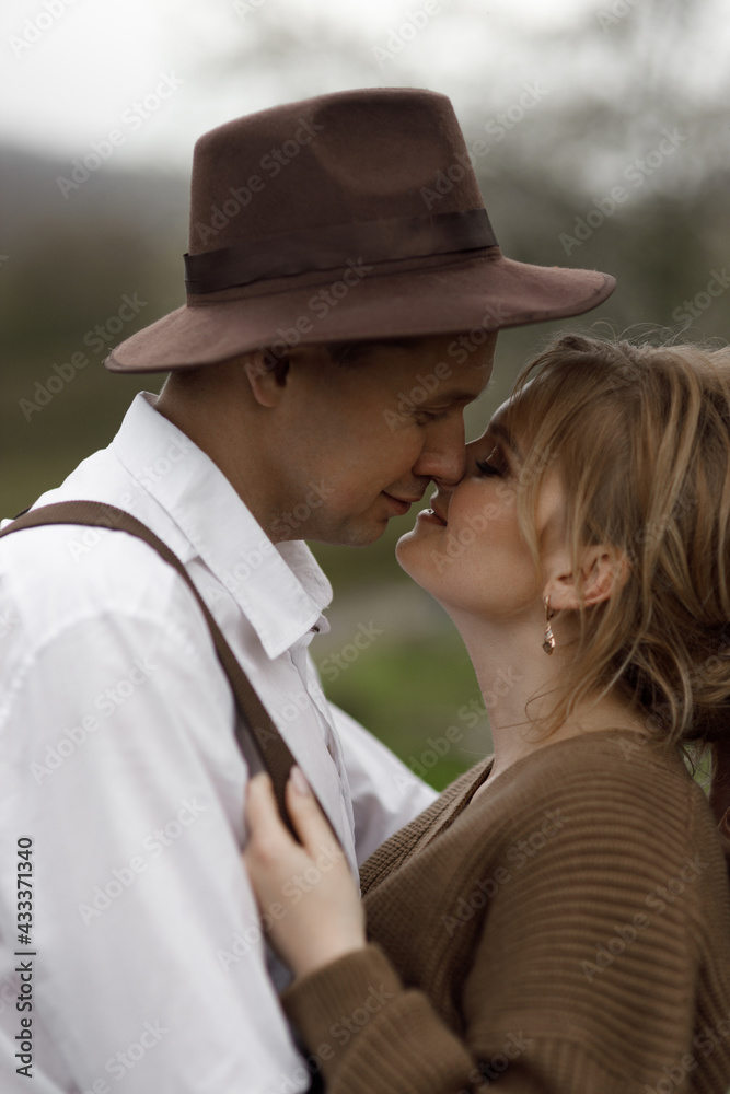 The couple enjoys the view of nature among the tea plantations. A farm ...