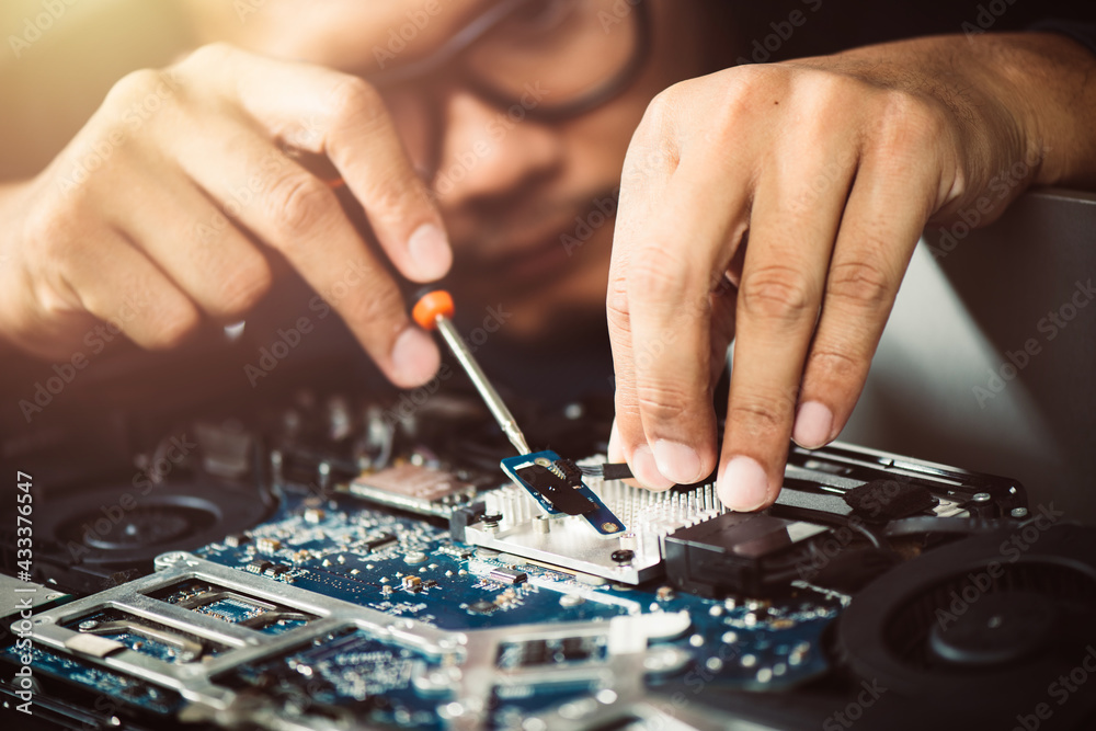repairing the broken computer Stock Photo | Adobe Stock
