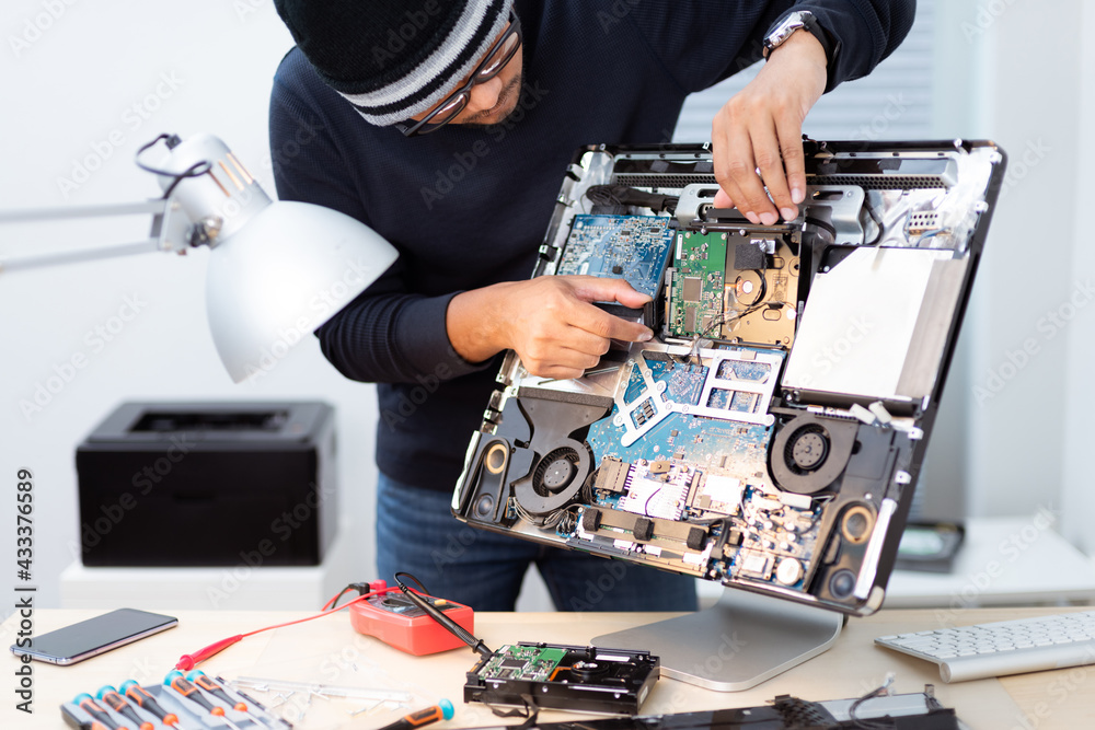 repairing the broken computer Stock Photo | Adobe Stock