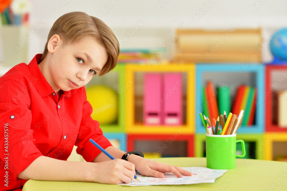 Portrait of cute little boy drawing with pencils Stock Photo | Adobe Stock