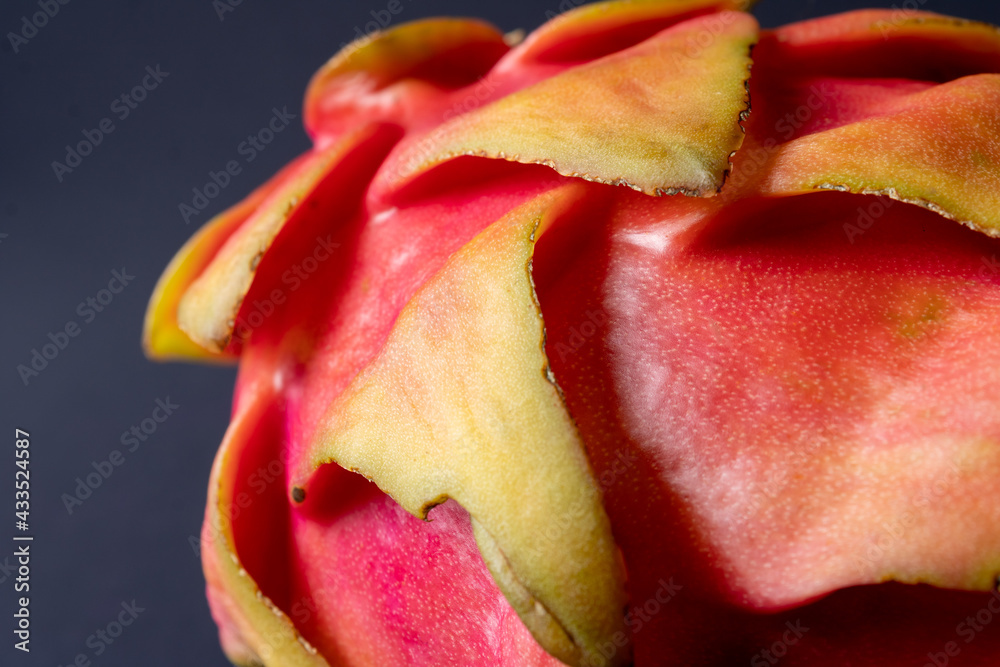 Part of a Pitaya on a dark black background. The pitaia, also known as ...