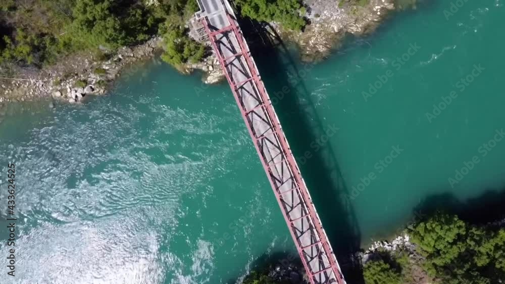 Birds eye view descending as a car crosses over the Clyde Bridge New ...