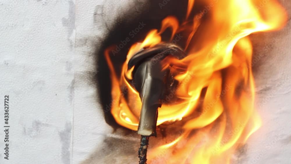 The plug from the electrical appliance inserted into the socket burns ...