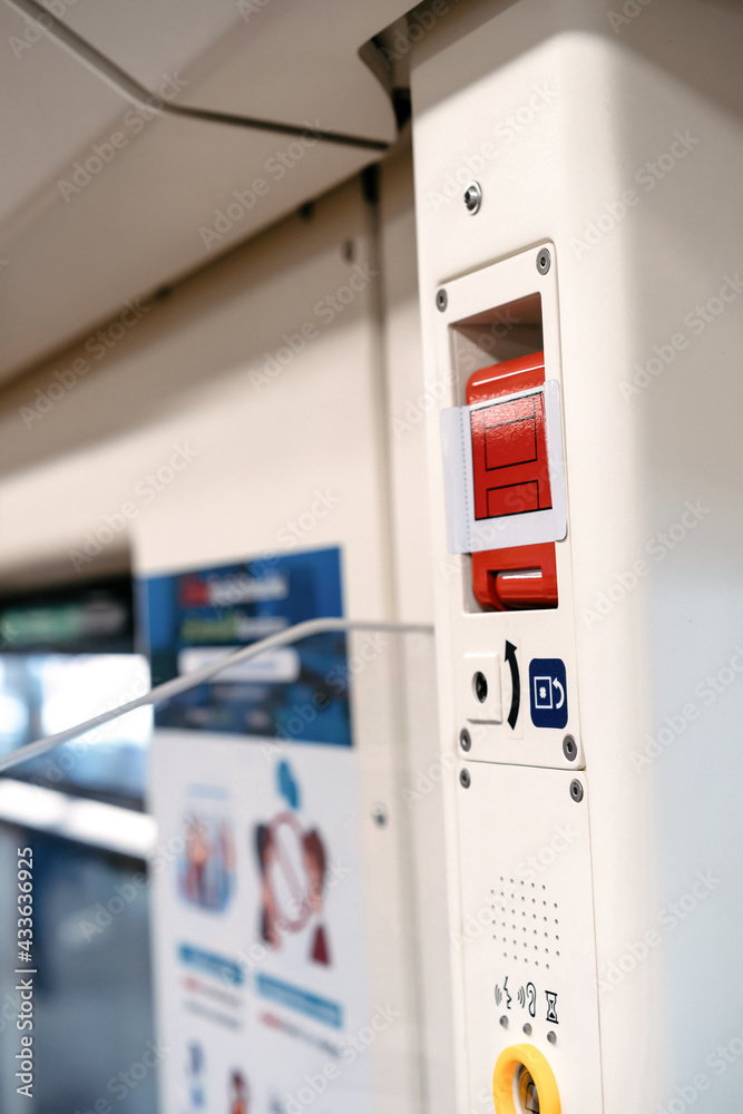 the red emergency door release switch control inside the sky train, it ...