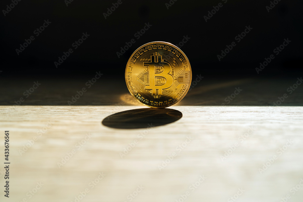 Metal coin with ornament and letter representing cryptocurrency symbol ...