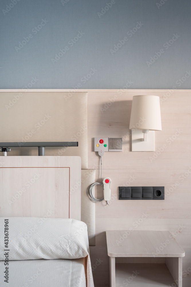 Nurse call system with emergency buttons installed near bed in ...