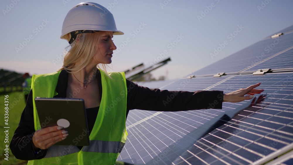 Female ecological engineer uses digital tablet and collects efficient ...