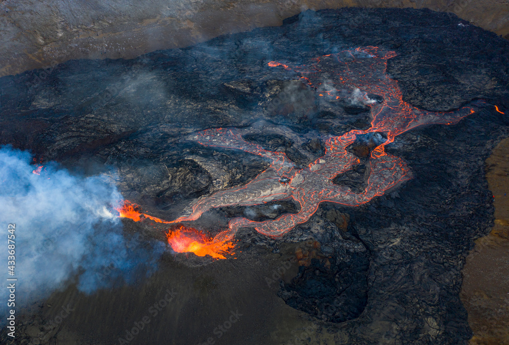 Foto de From above magma sparks out of the volcano hole and run like ...