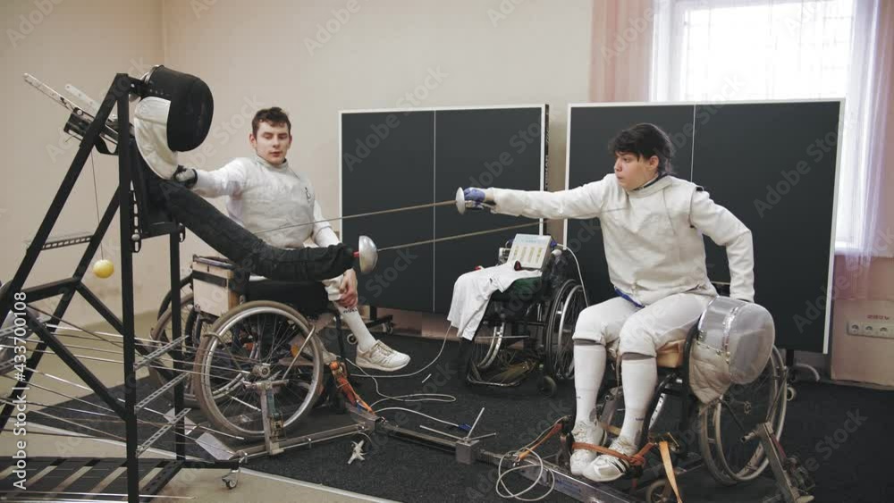 disabled athlete. fencing. workout of wheelchair fencing athletes with ...