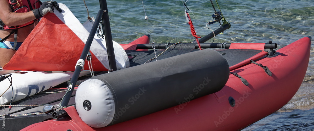 Yachtsman Or Sailor Man Prepares The Inflatable Rubber Catamaran Boat ...