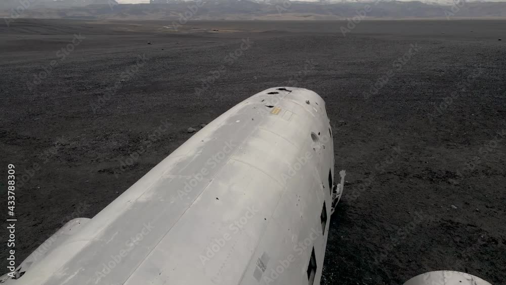 Vidéo Stock Aerial forward over destroyed fuselage of airplane relict ...