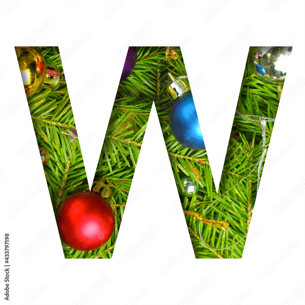 Alphabet on ?hristmas tree. The letter W cut out of paper on a ...