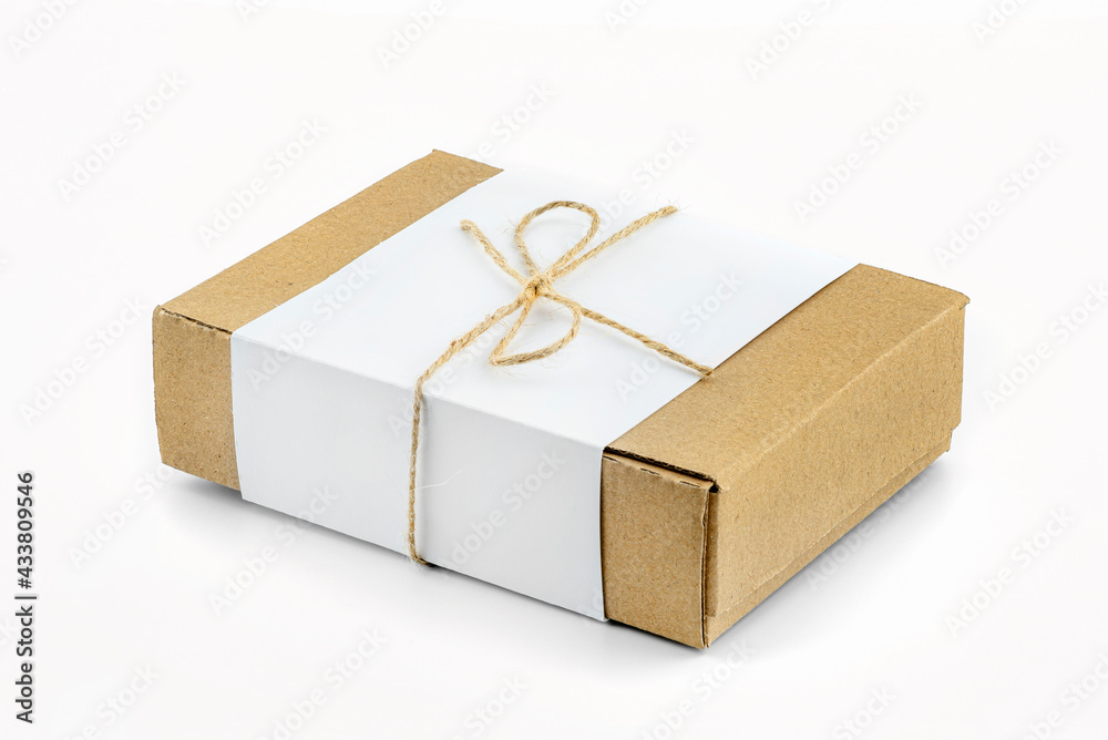A small cardboard box made of corrugated cardboard wrapped with a white ...