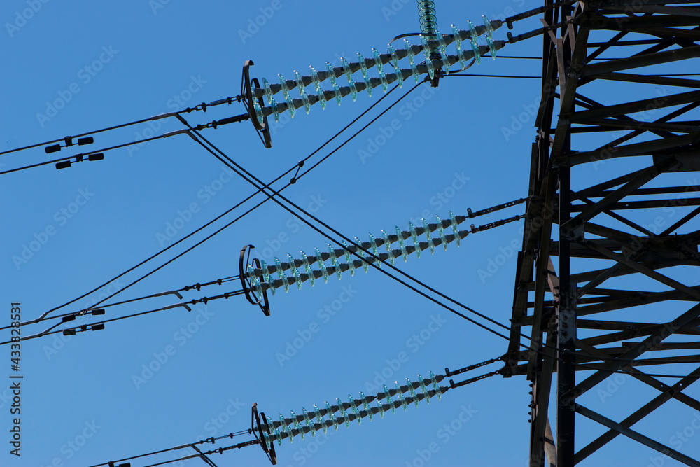 power line of cables and insulators close up. electrical insulators ...